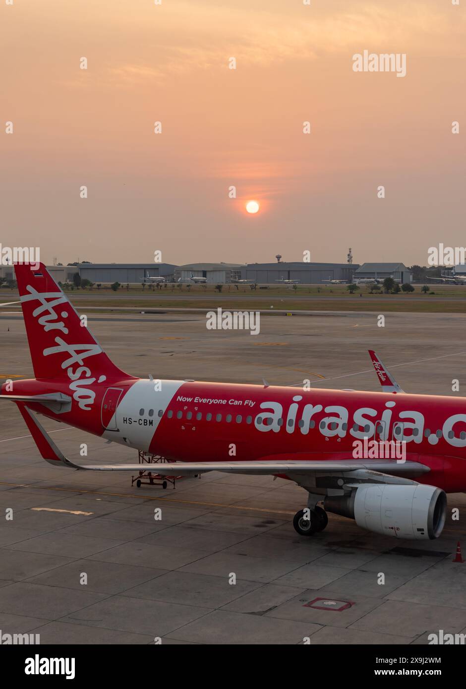 A picture of an AirAsia plane at sunrise Stock Photo - Alamy
