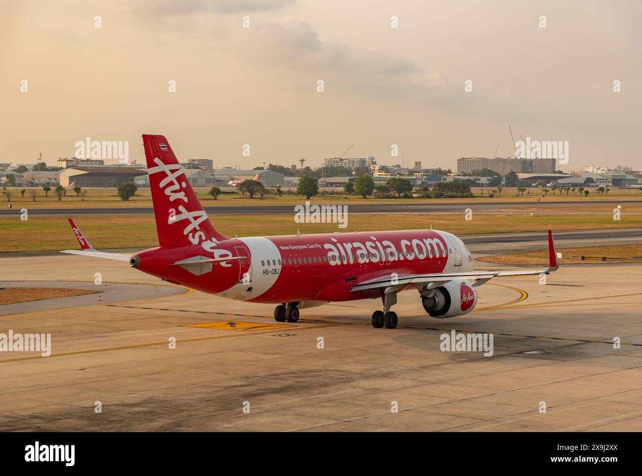 A picture of an AirAsia plane at sunrise Stock Photo - Alamy