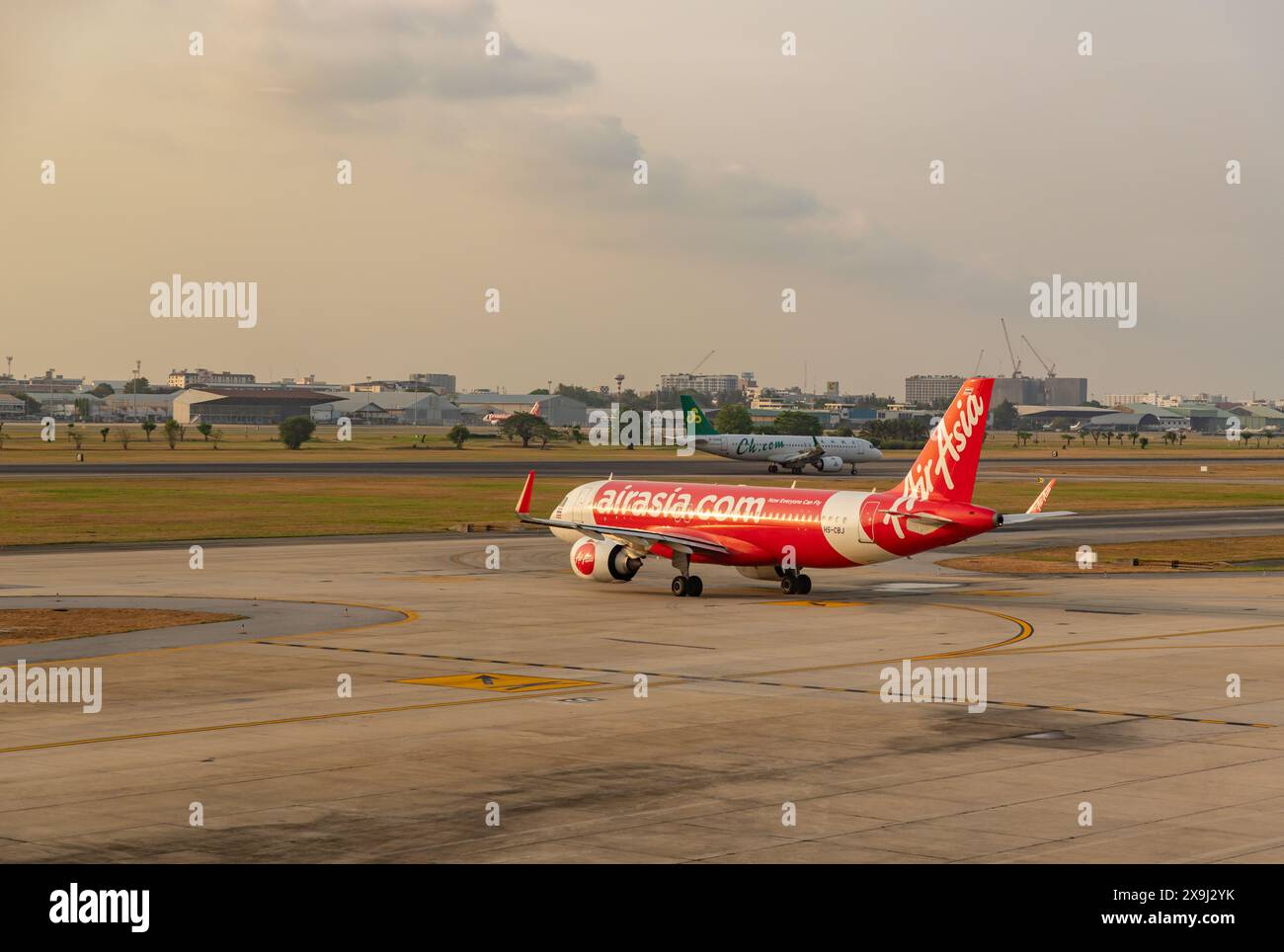 A picture of an AirAsia plane at sunrise Stock Photo - Alamy