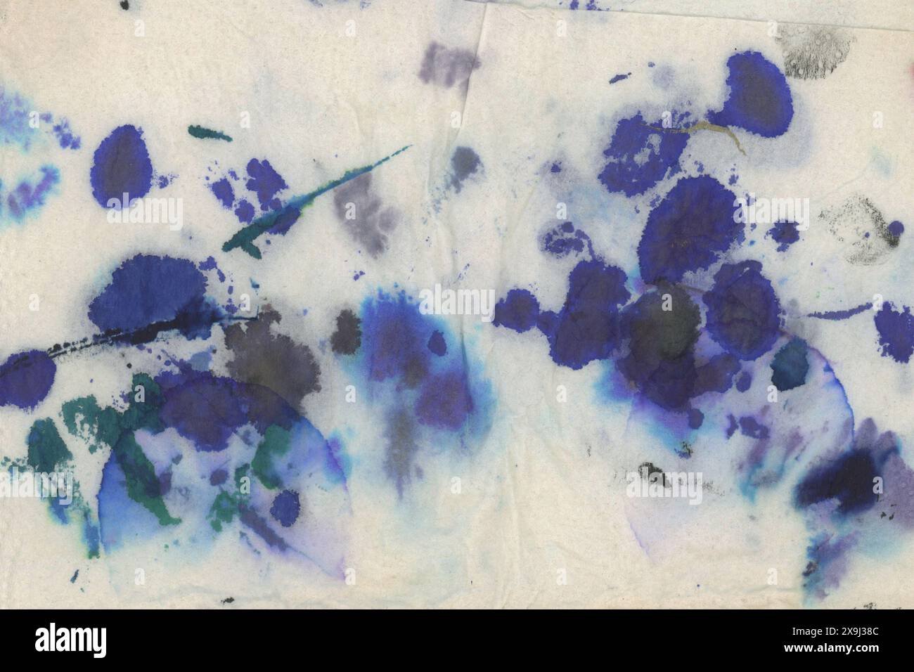 Authentic black and blue ink stains on white kitchen paper Stock Photo ...