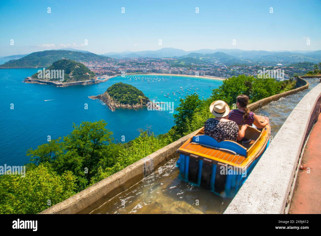 Fairground atraction and overview of the city. Monte Igueldo, San ...