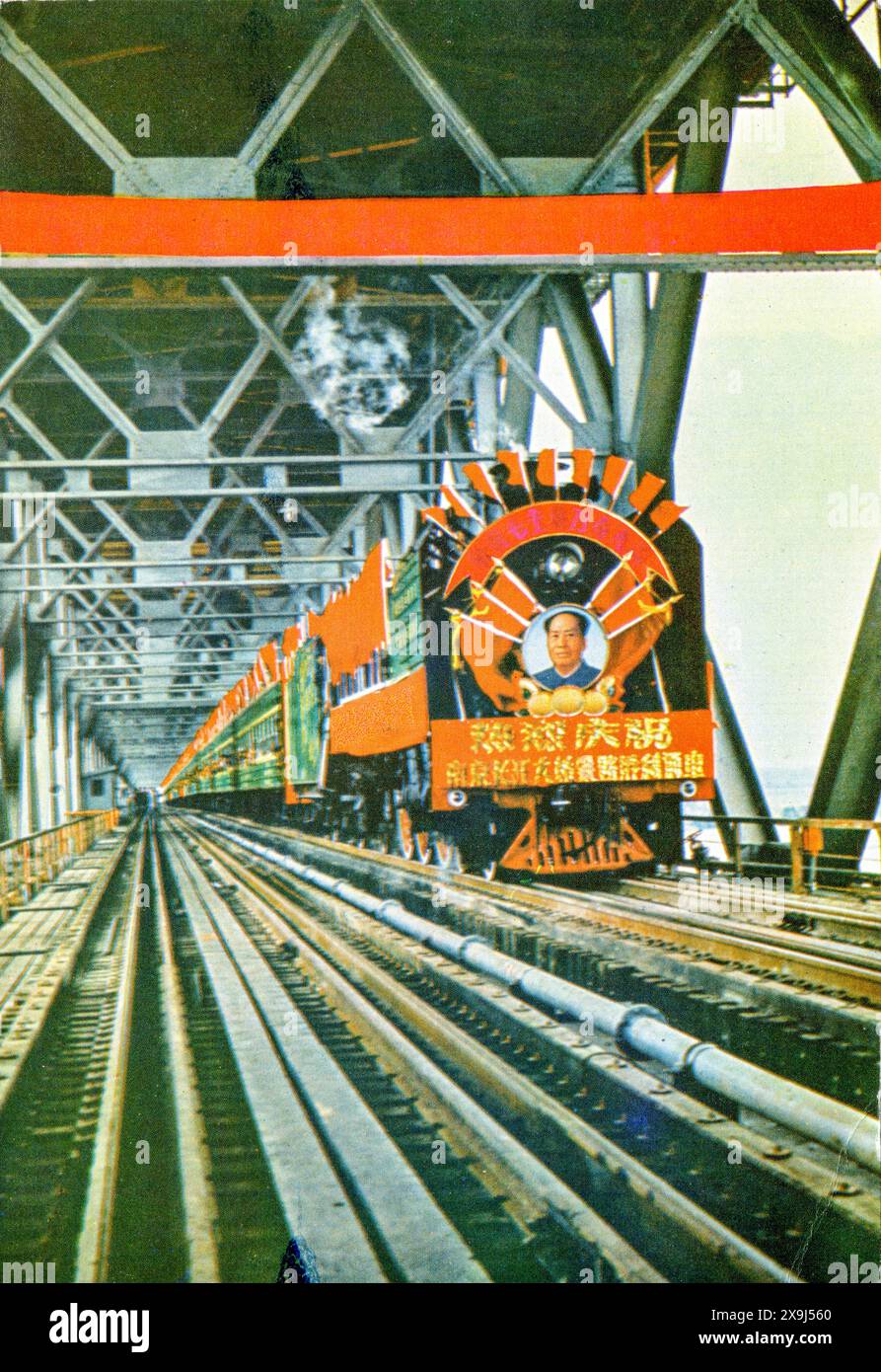 An A5 size postcard image of the first train crossing the lower train ...