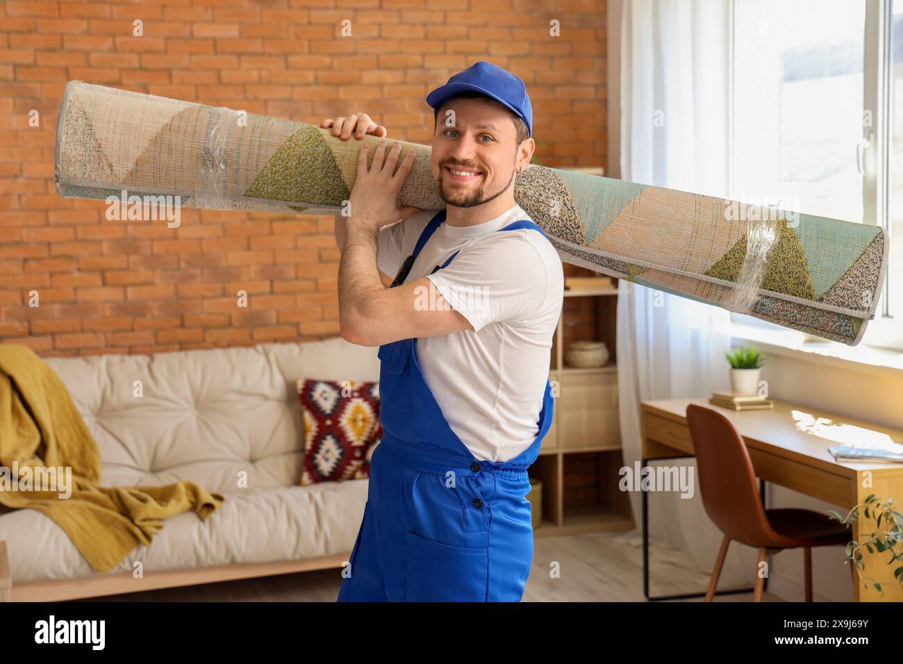 Person in rolled carpet hi-res stock photography and images - Alamy