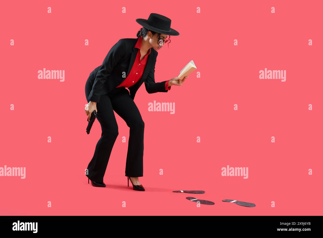 Female African-American spy with gun and notebook tracing footprints on ...