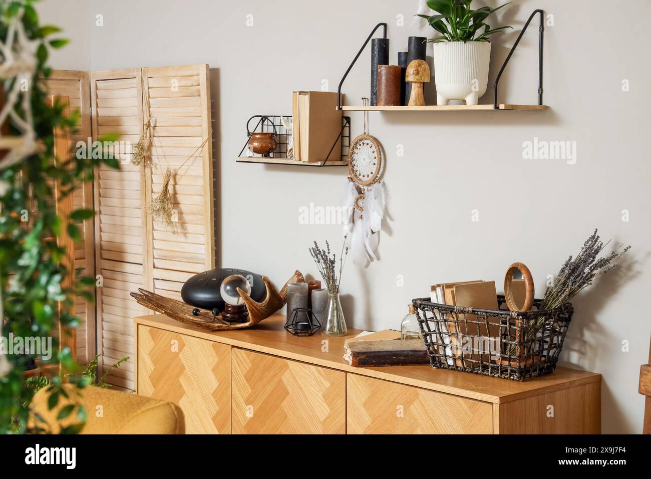 Interior of witch's room with magic attributes, shelves and commode ...