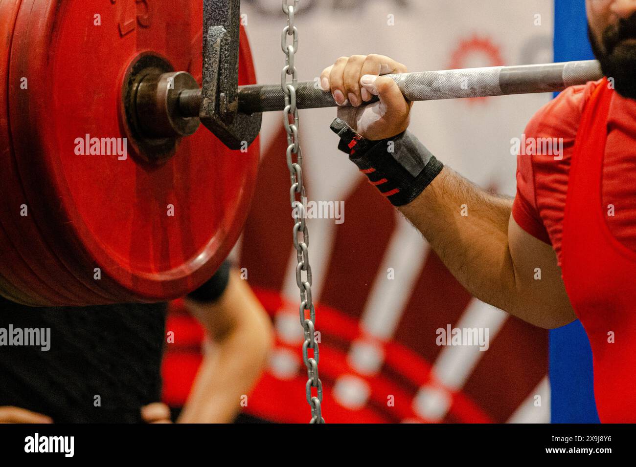 man powerlifter starting squat exercise at powerlifting competition ...
