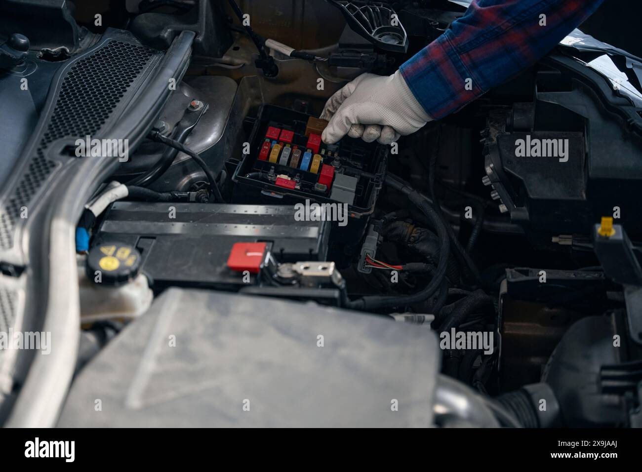 Close up photo of man installing relay Stock Photo - Alamy
