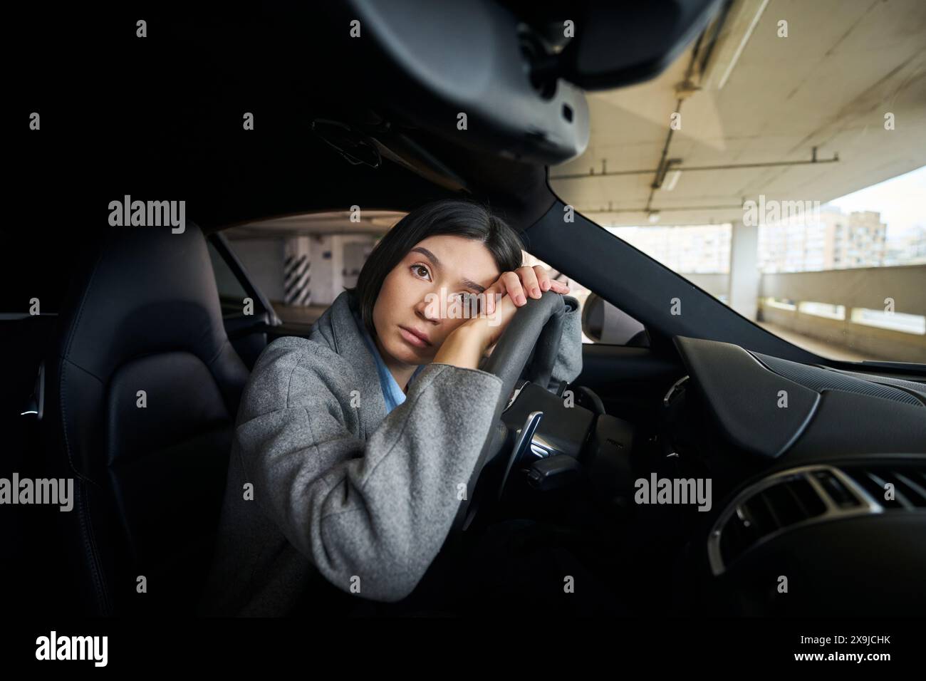 Sad lady suffer from stress inside car Stock Photo - Alamy