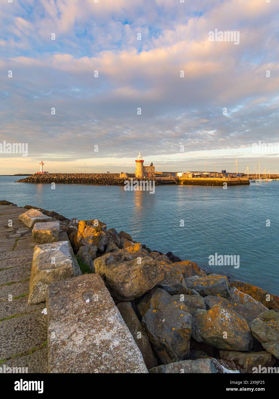 Golden hour light reflecting on Howth Lighthouse Stock Photo - Alamy