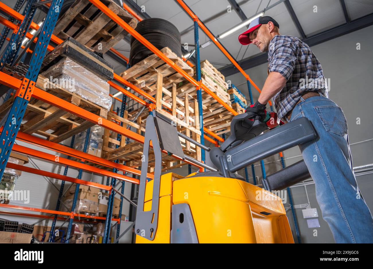 Warehouse Worker Operating Forklift Stock Photo - Alamy