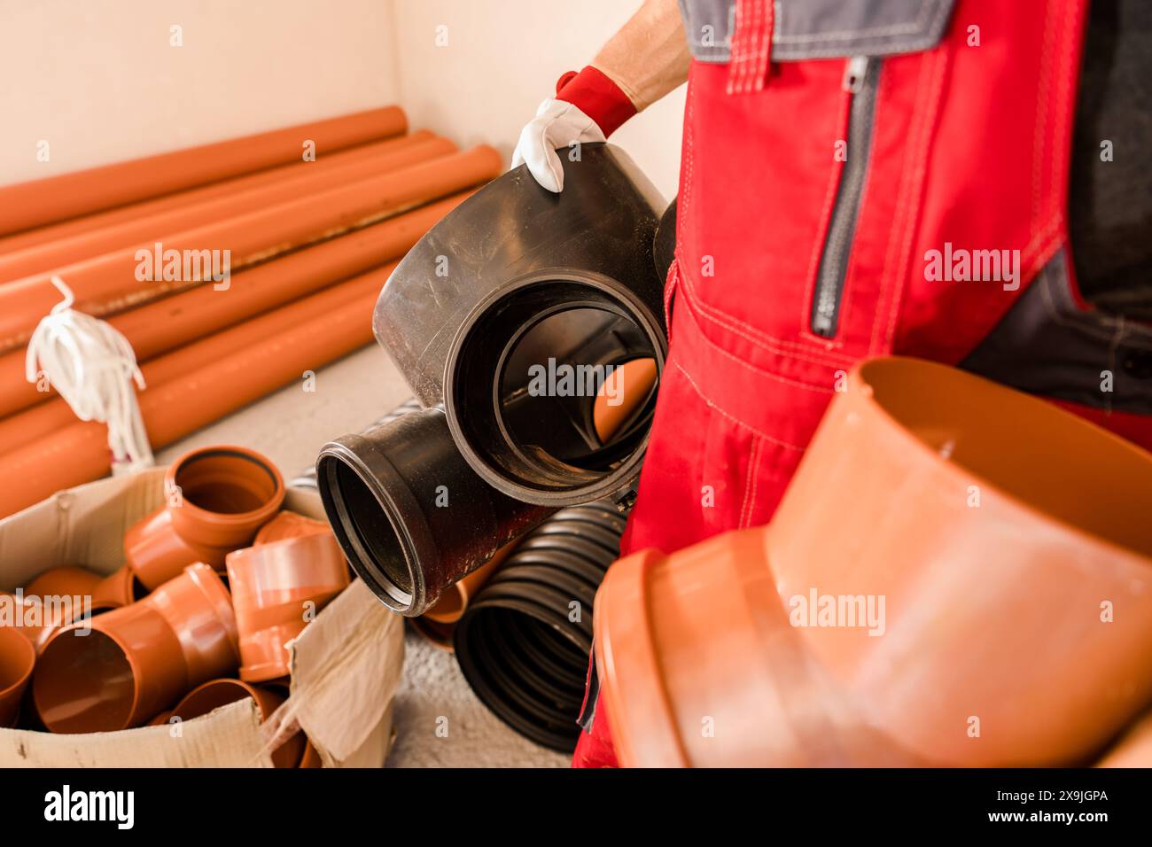 Plumber Holding PVC Pipes Stock Photo - Alamy