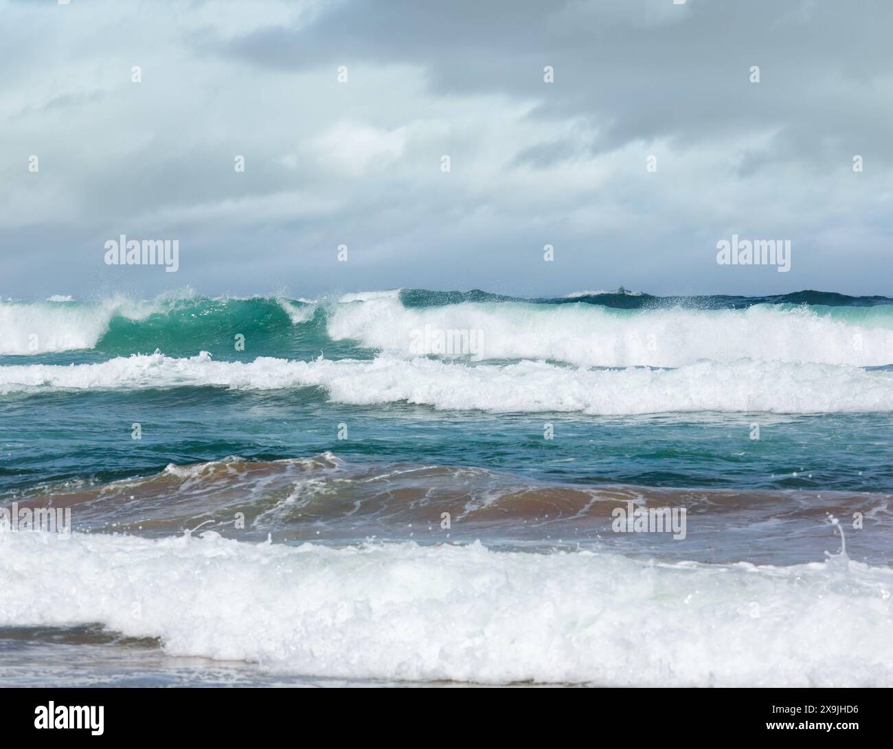Ocean storm waves with foam and splashes. View from beach Stock Photo ...
