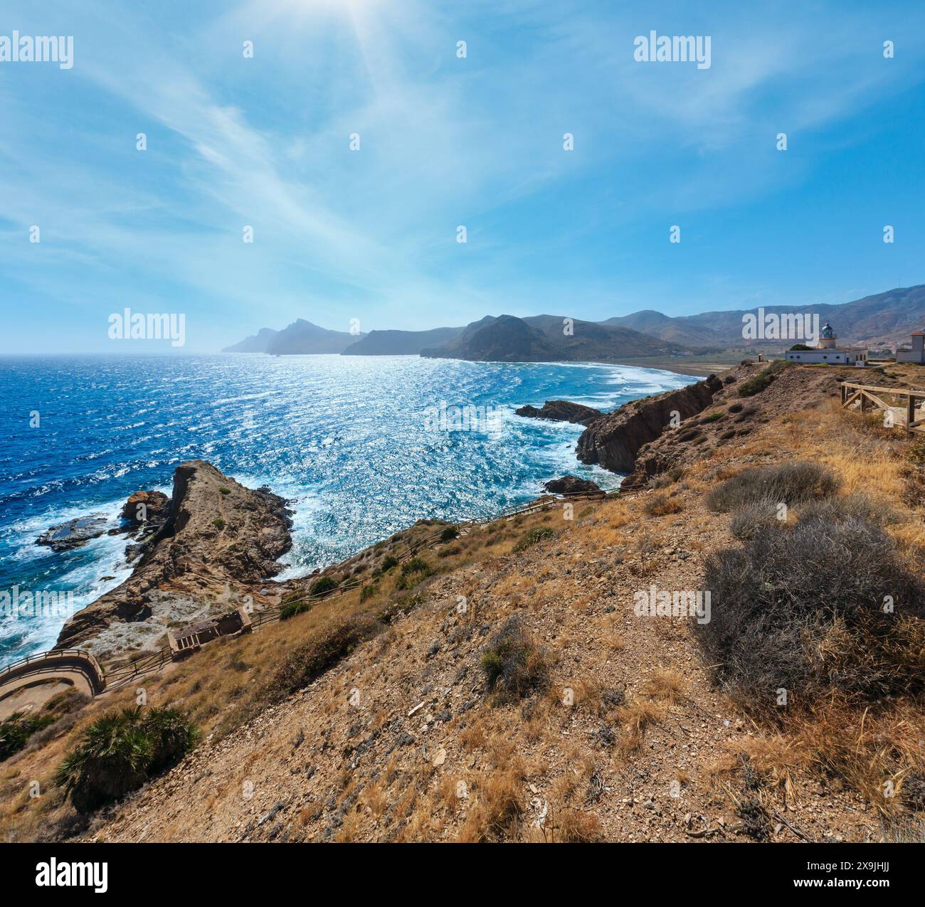 Mediterranean sea summer rocky coast view and lighthouse El hoyo del ...