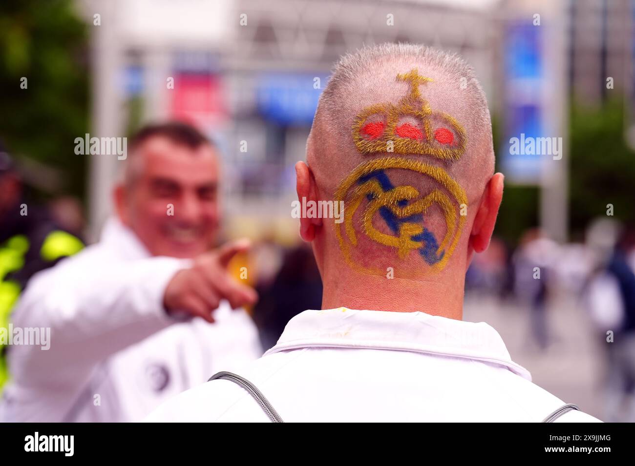 A Real Madrid fan with the club crest cut and dyed into their hair ...