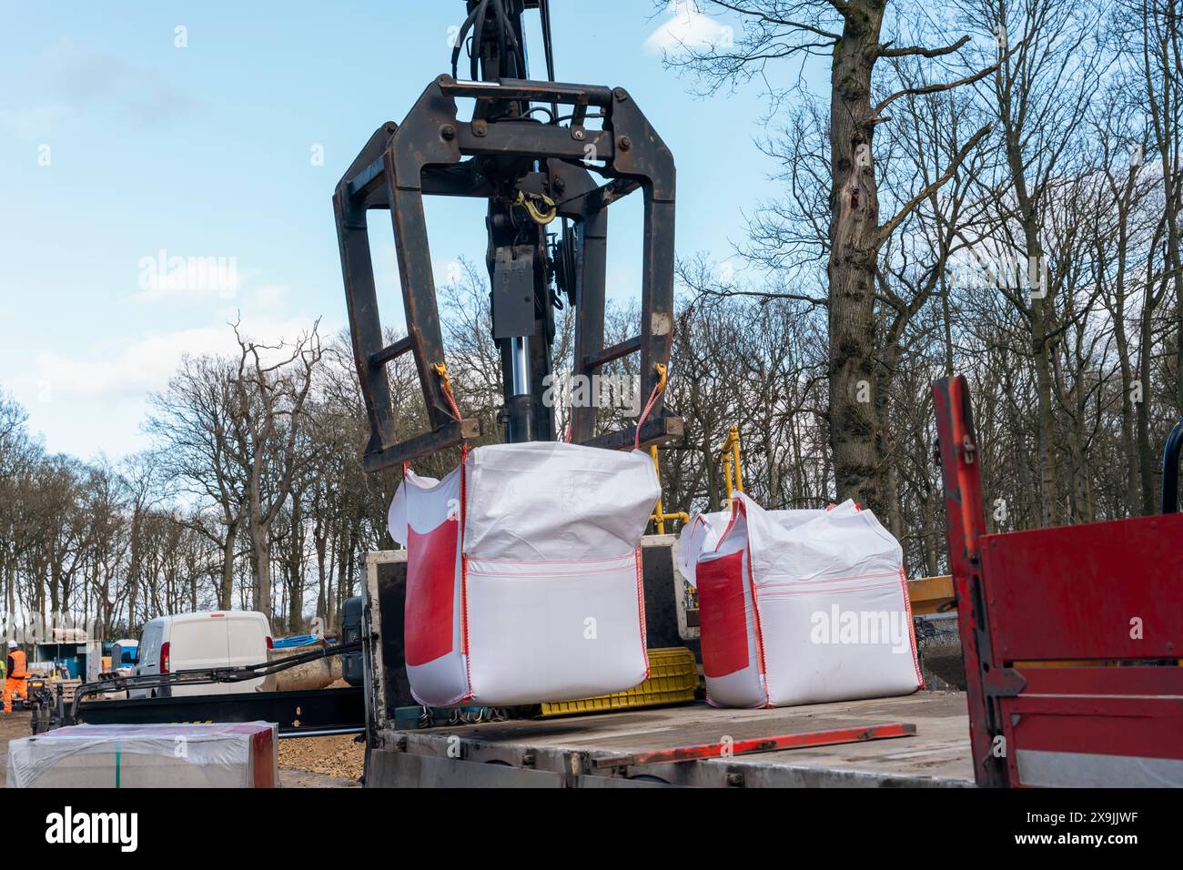 Dropside flatbed HIAB crane lorry with brick grab attachment deliver ...