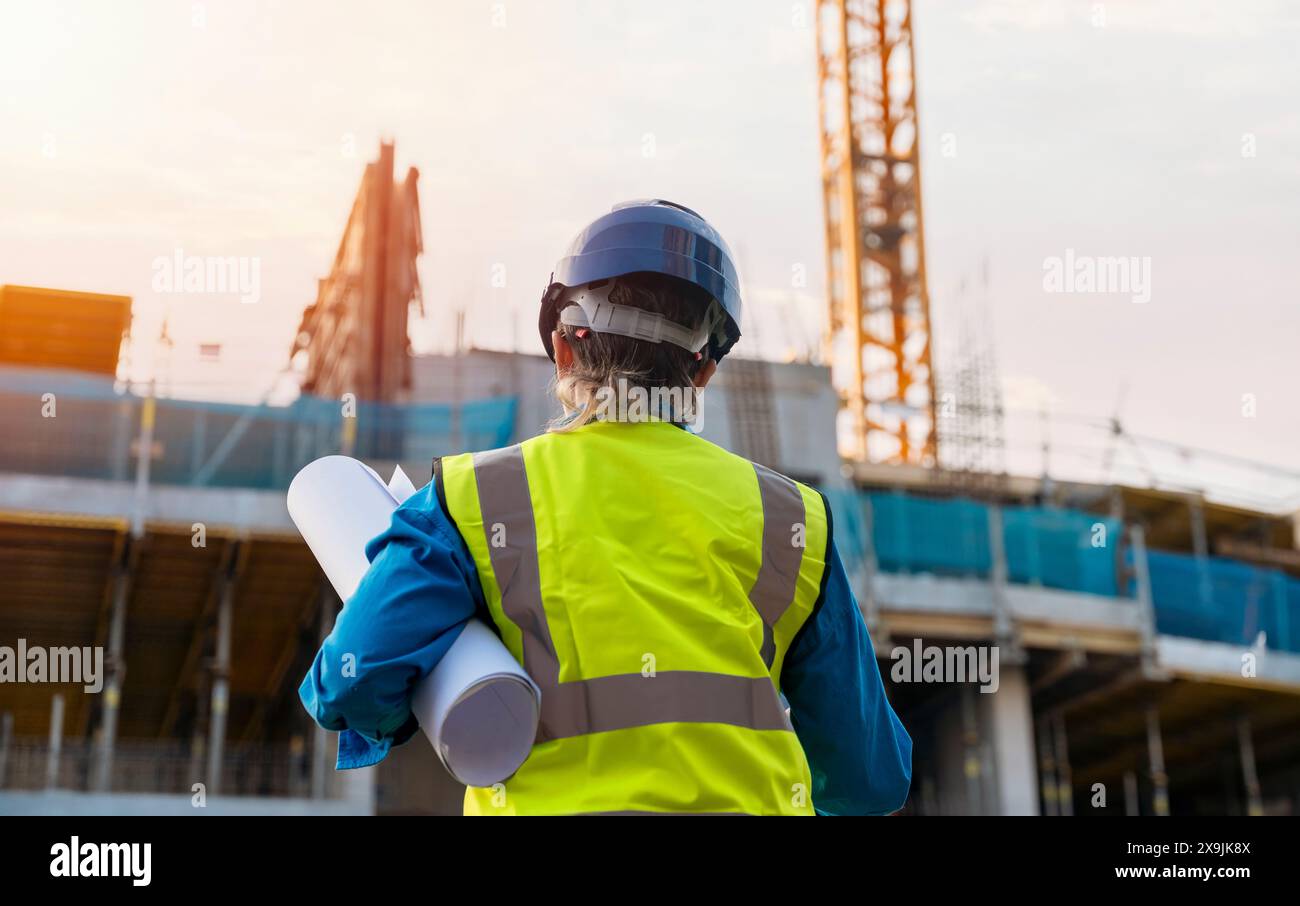 Female site engineer surveyor working with theodolite total station EDM ...