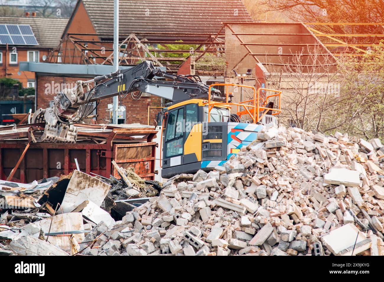 Demolition of building. Excavator breaks old house. Making space for ...