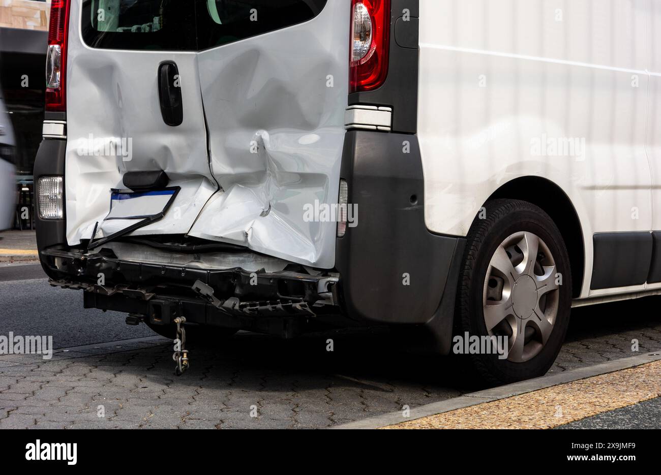 White van damaged after a rear-end collision when the other driver was ...