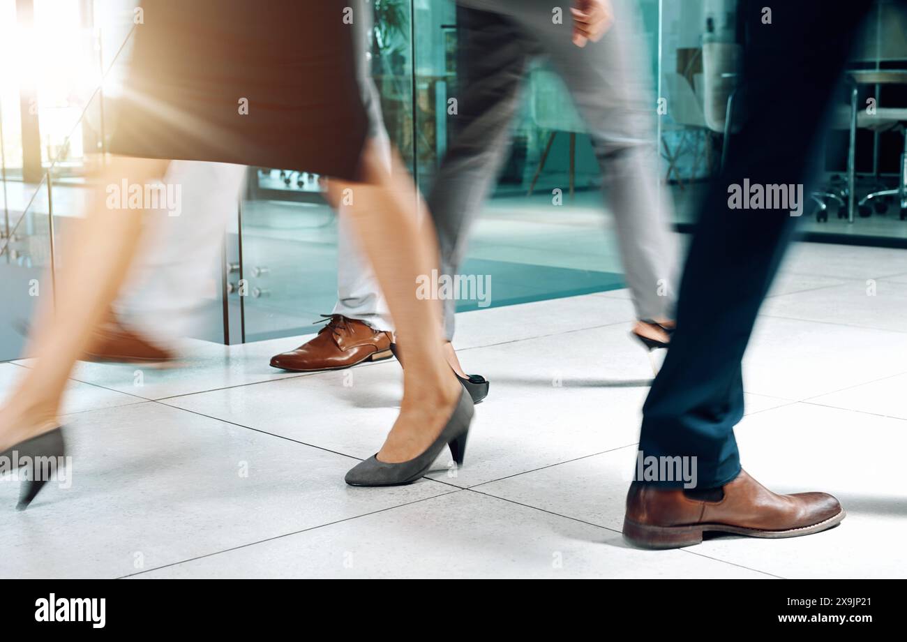 Office, motion blur and legs of business people for walking, movement ...