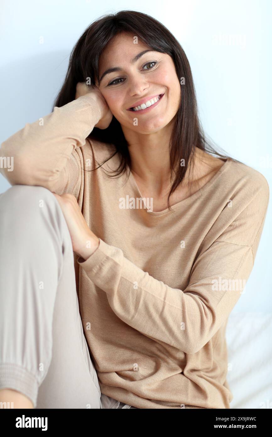 Portrait absorbed young woman sitting hi-res stock photography and ...