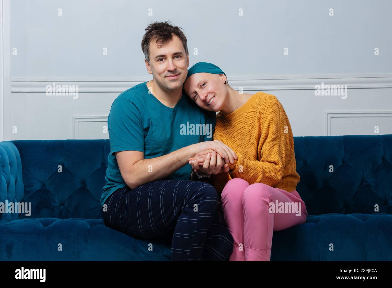 Couple shares a loving embrace celebrating recovery from cancer Stock ...