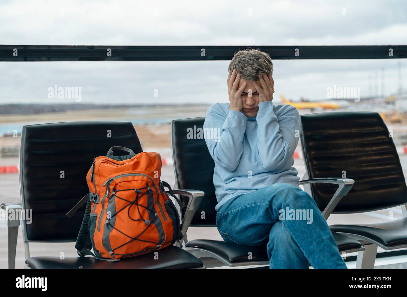 Sad man waiting delayed flight hi-res stock photography and images - Alamy