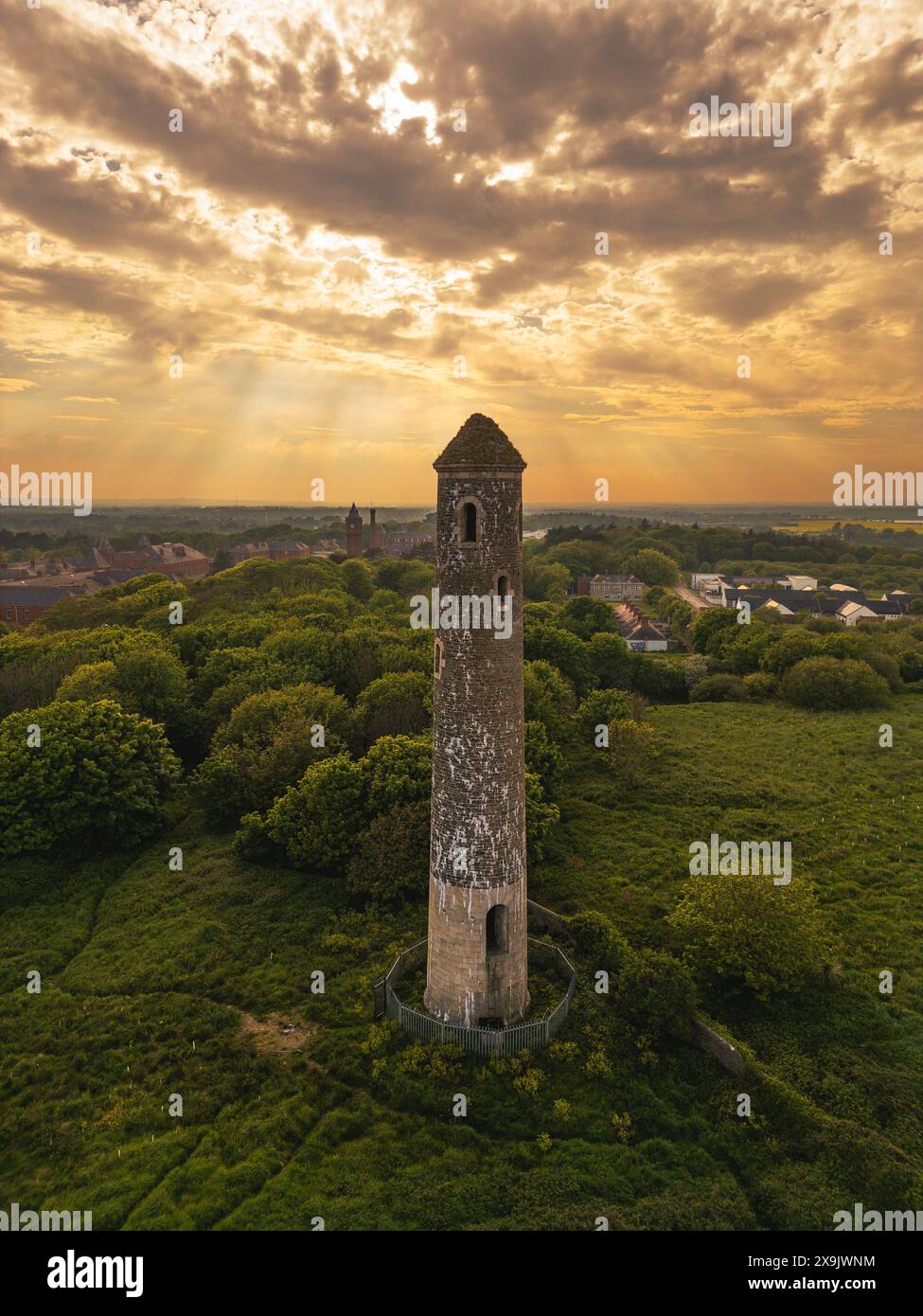 Sunbeams over the Portrane Round Tower Stock Photo - Alamy