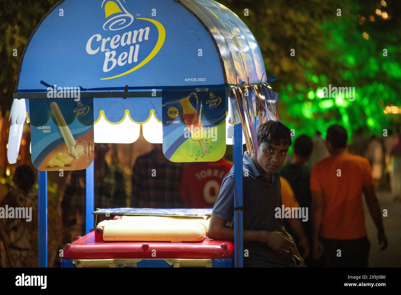 Cream Bell Ice cream wagon truck cart at night with people surrounding ...
