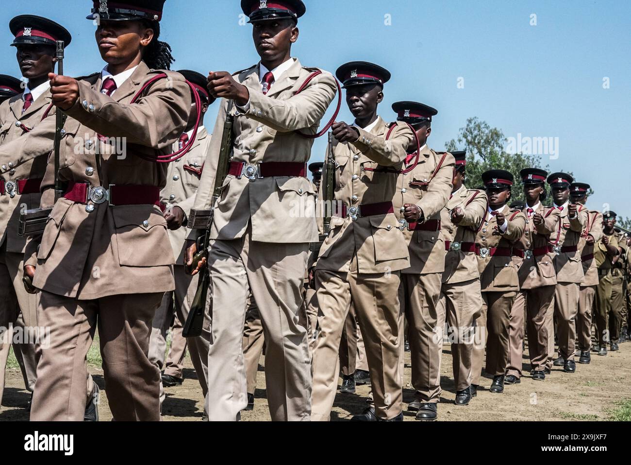 Kenyan police officers wearing ceremonial uniform march during the ...