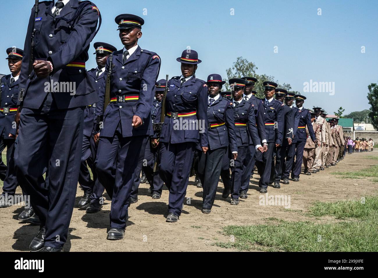 Kenyan police officers wearing ceremonial uniform march during the ...
