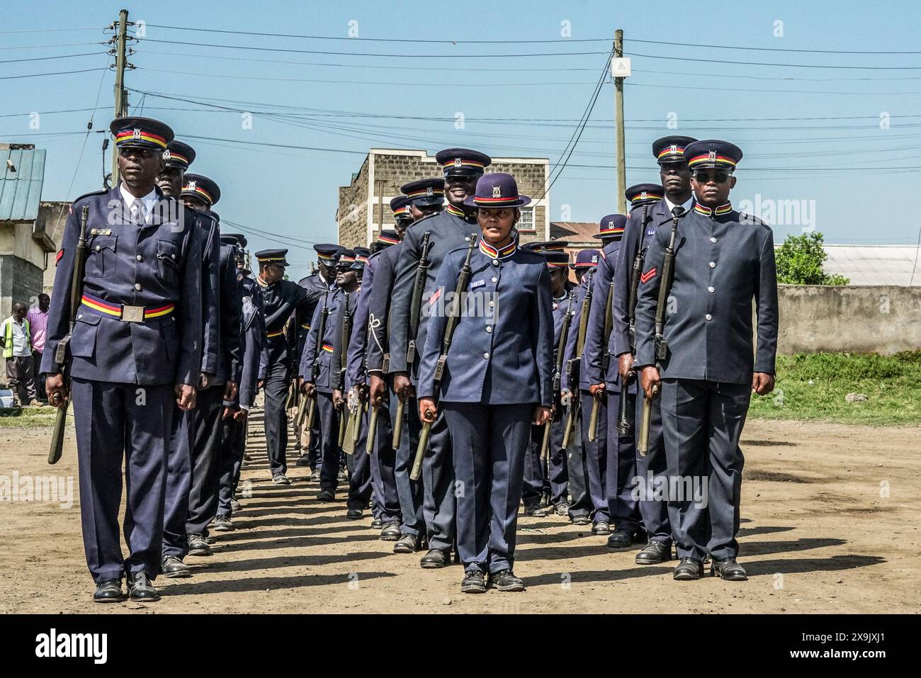 Kenyan police officers wearing ceremonial uniform march during the ...