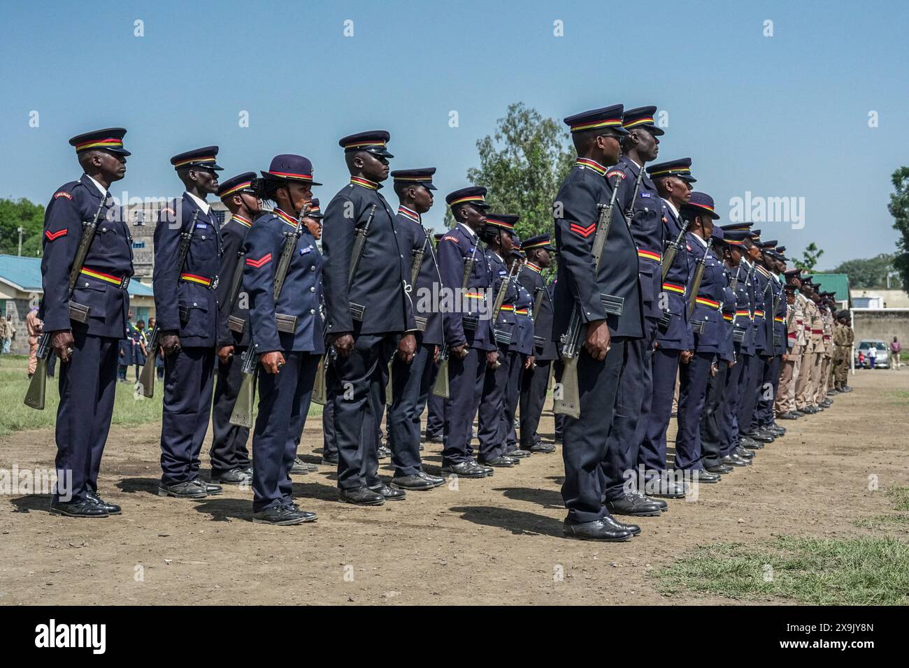 Kenyan police officers wearing ceremonial uniform participate in a ...