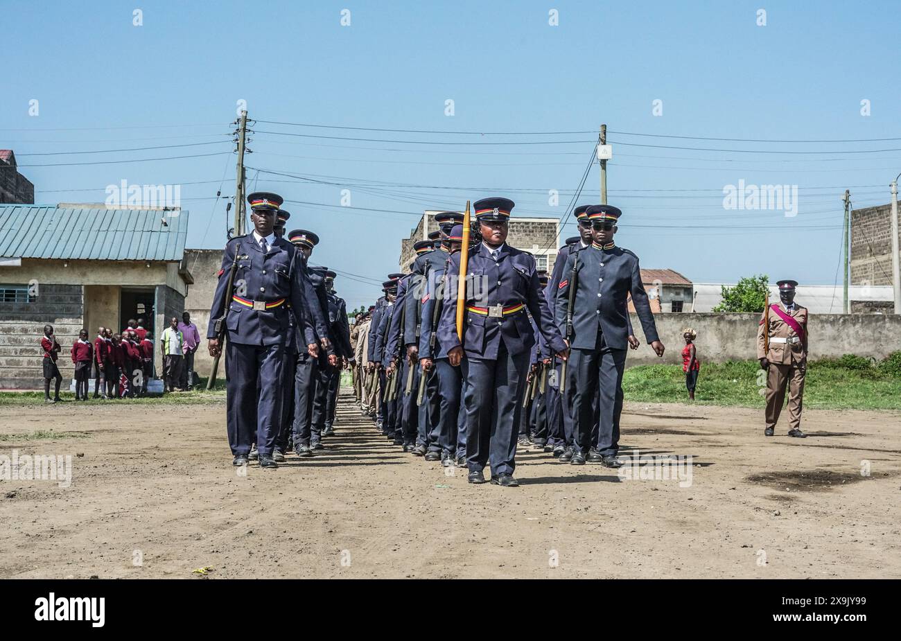 Kenyan police officers wearing ceremonial uniform march during the ...