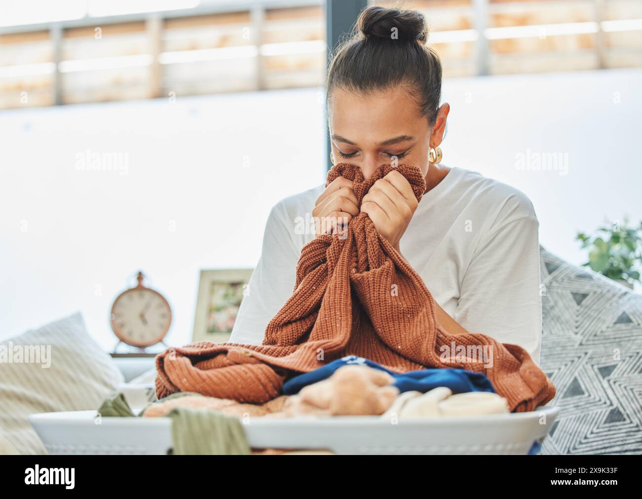 Woman, smell and clean laundry clothes at house with fresh, fabric ...