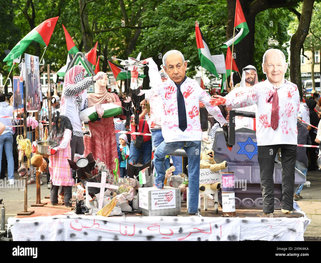 01 June 2024, Berlin: Figures covered in bloody handprints with the ...