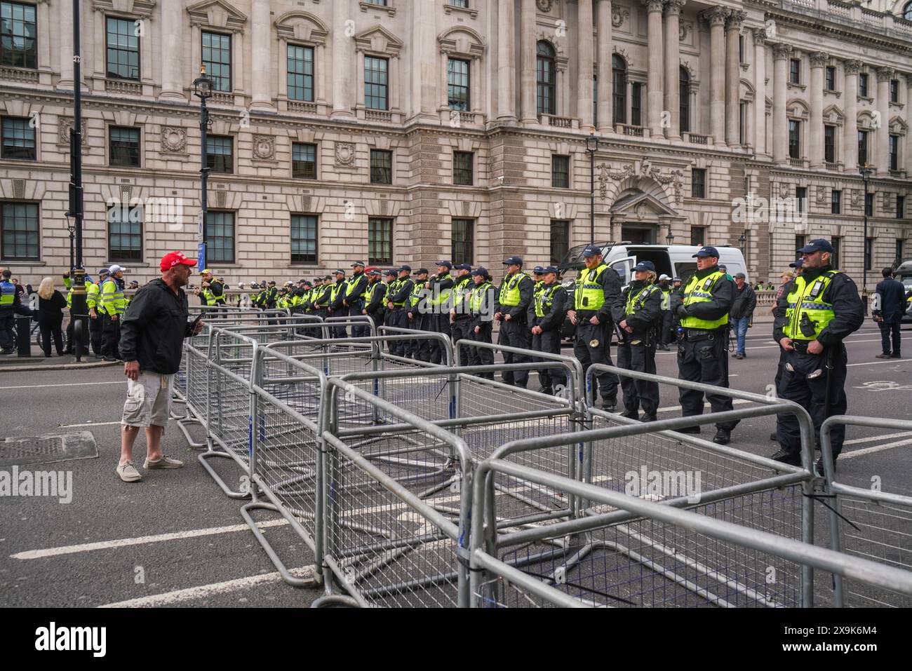 London, UK. 1 June 2024. Police set up barriers in Whitehall during a ...