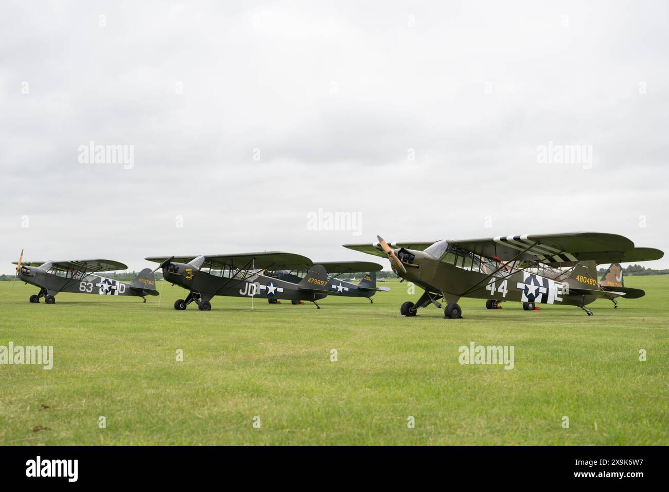 Five Piper L4 Grasshopper sit on the flightline ahead of, the Duxford ...