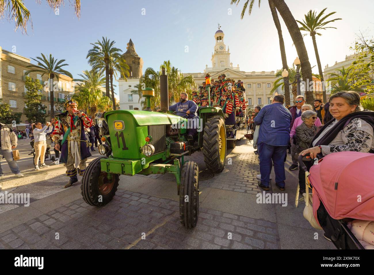 Carnival parade float with singers, entertainers in costumes being ...