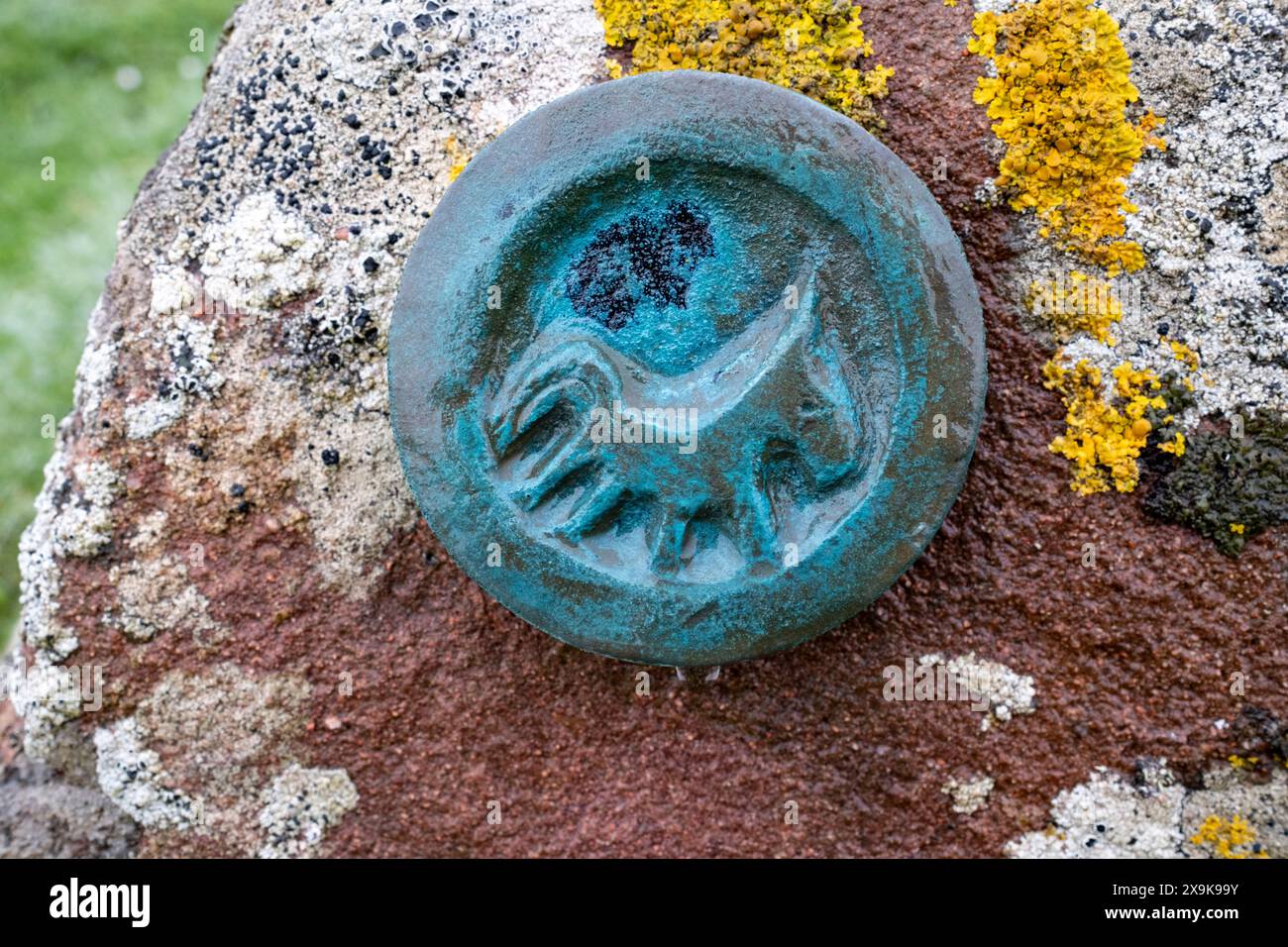 Metal artwork of a horse mounted on seaside rock at Clachtoll Bay on ...