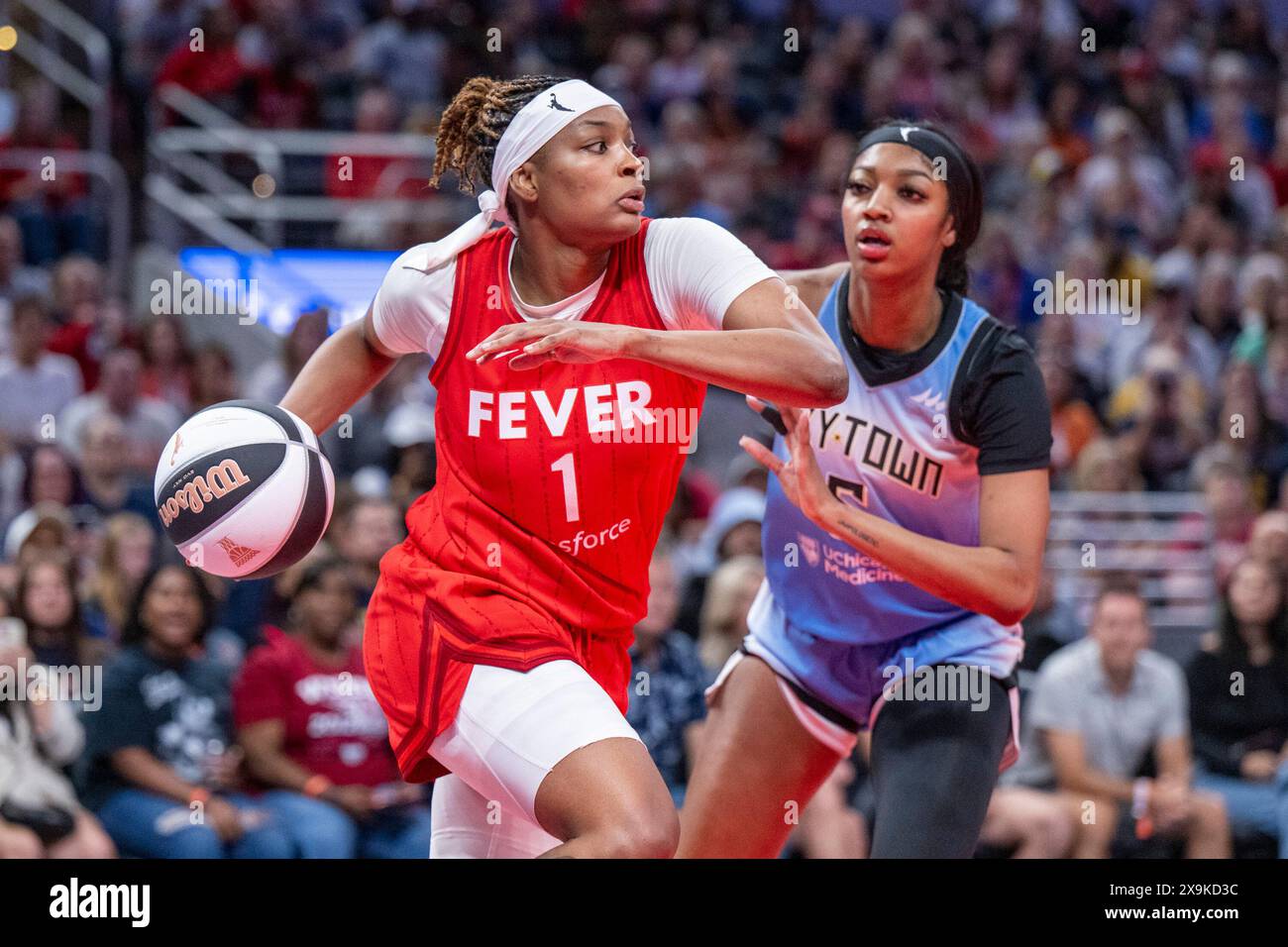 Indiana Fever forward NaLyssa Smith (1) looks to pass while being ...