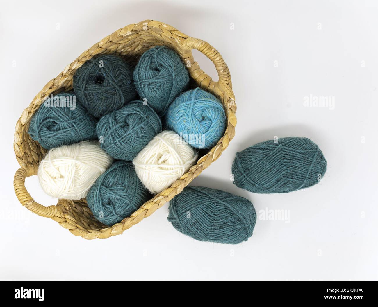 Flat lay photography of a turquoise, dark green, teal and white wool ...