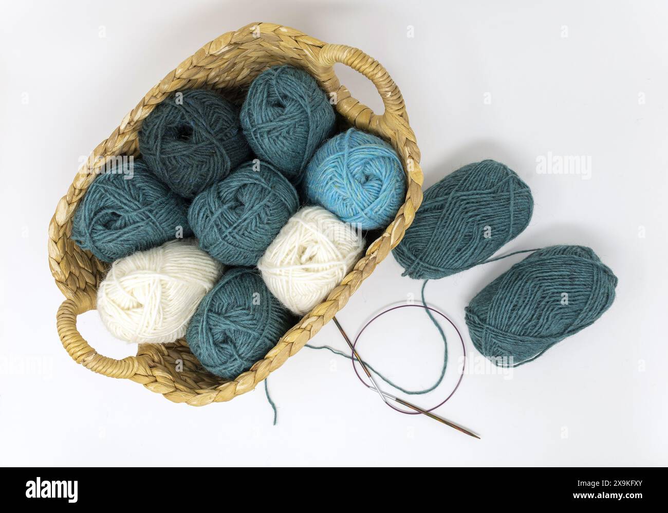 Flat lay photography of a turquoise, dark green, teal and white wool ...
