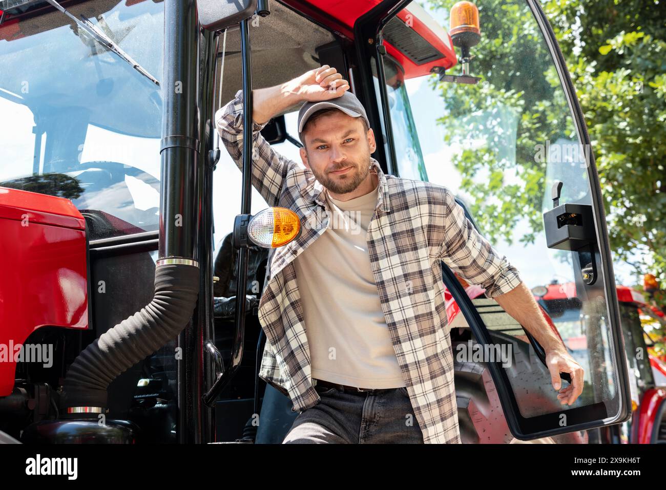 Farmer posing with tractor hi-res stock photography and images - Alamy