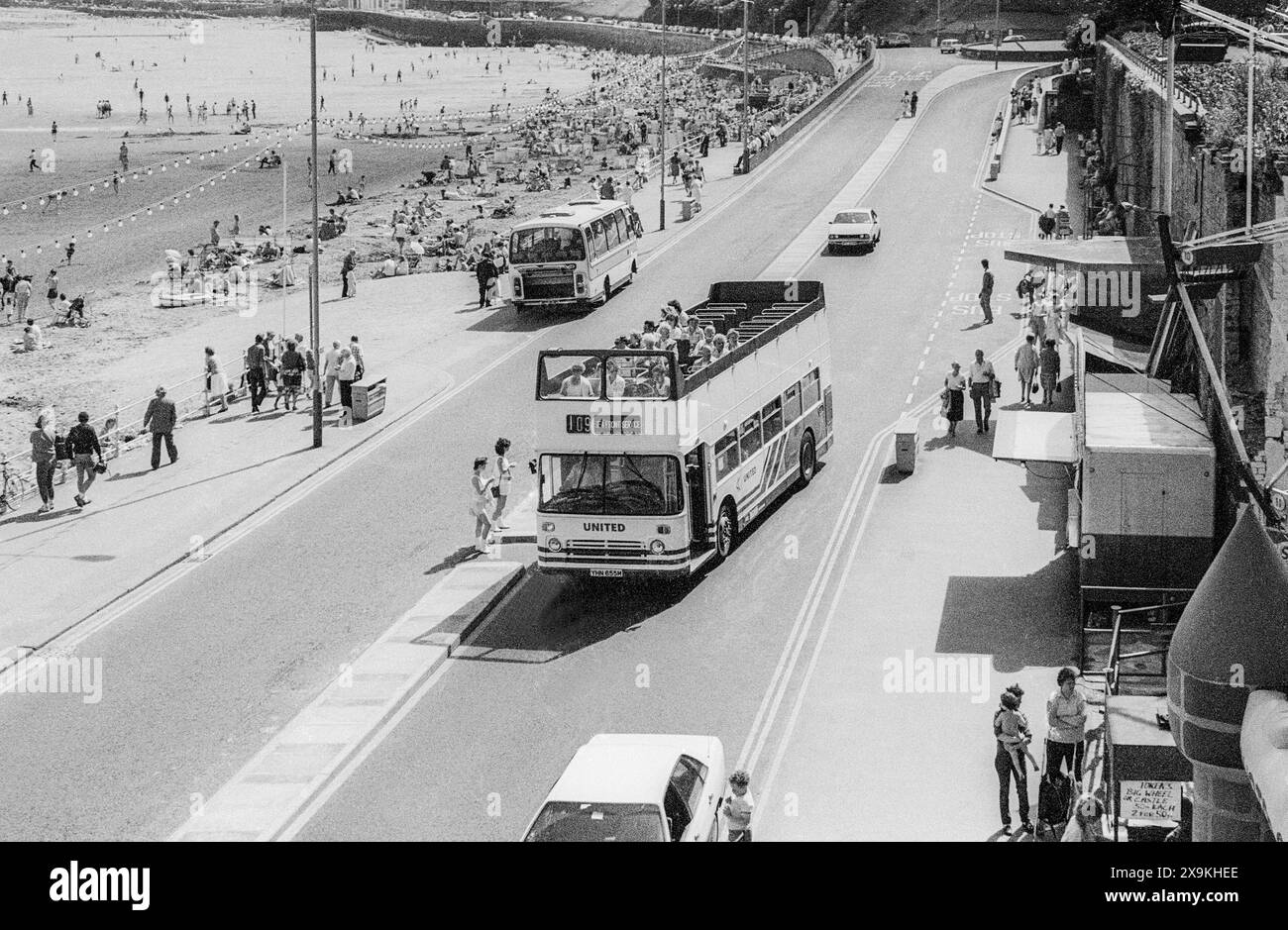 July 1986 black & white archive photograph of an open top bus ...
