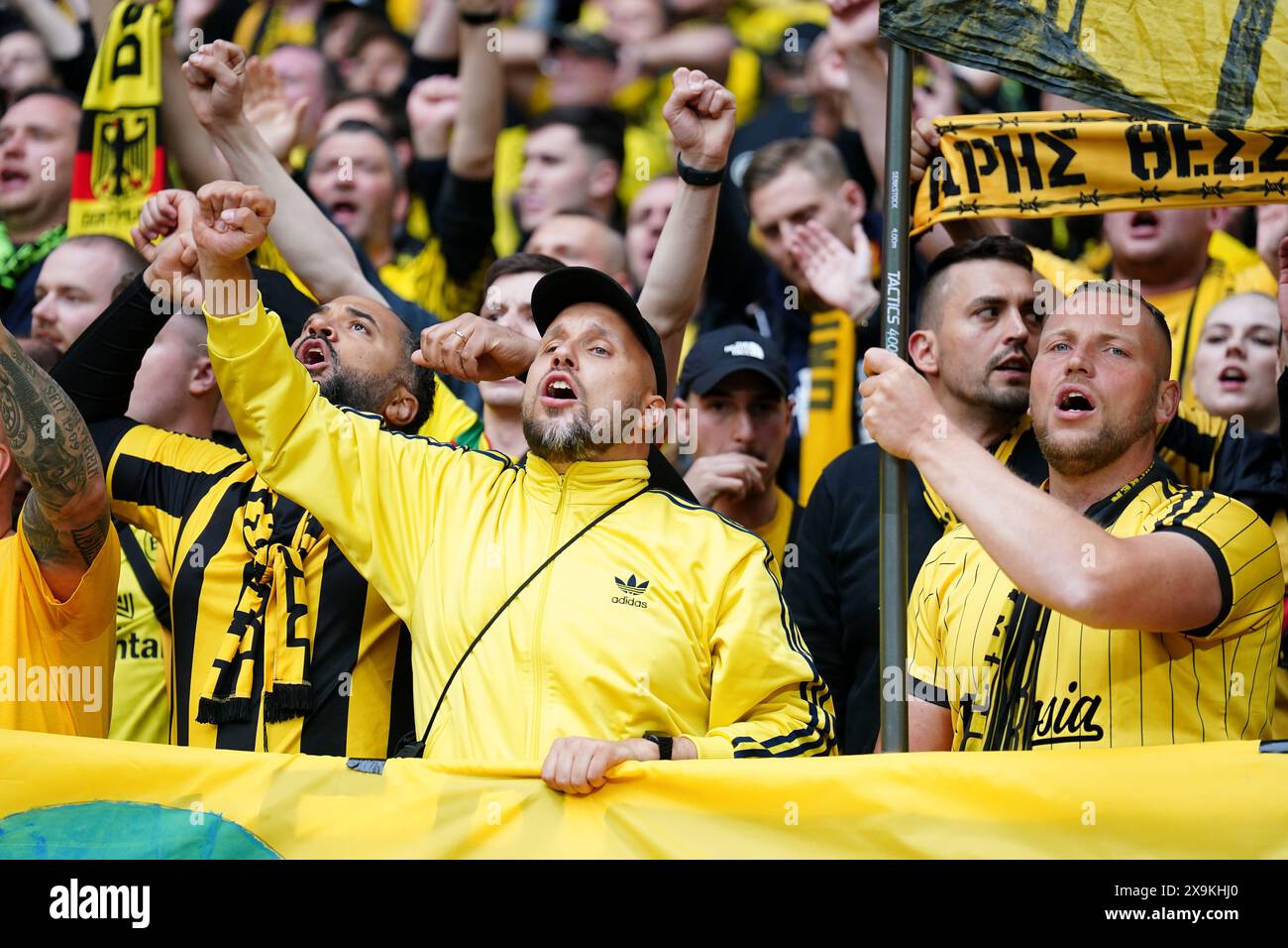 Borussia Dortmund fans show their support in the stands ahead of the ...