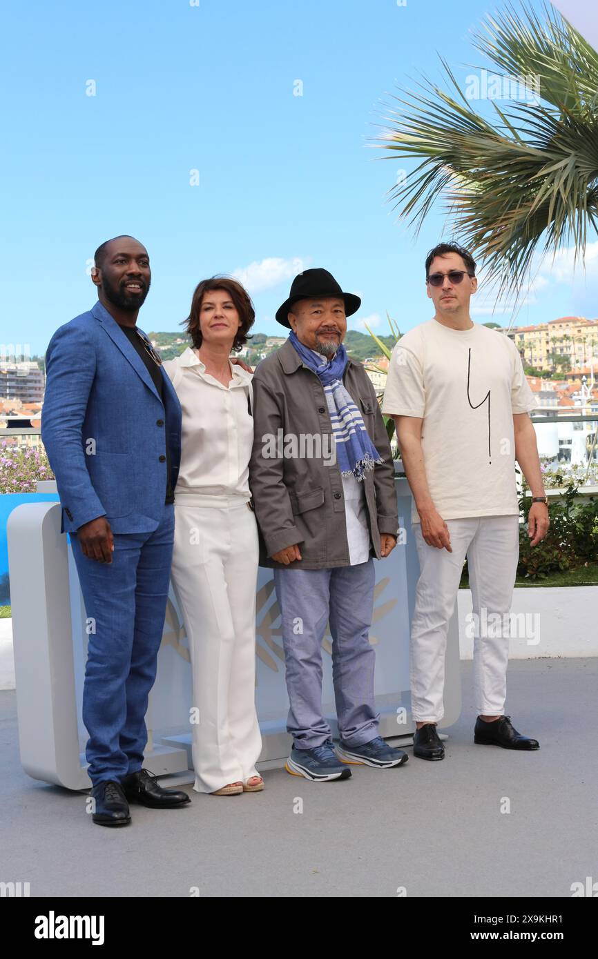 Cannes, France. 17th May, 2024. Cyril Guéï, Irène Jacob, Director Rithy Panh and Grégoire Colin ...