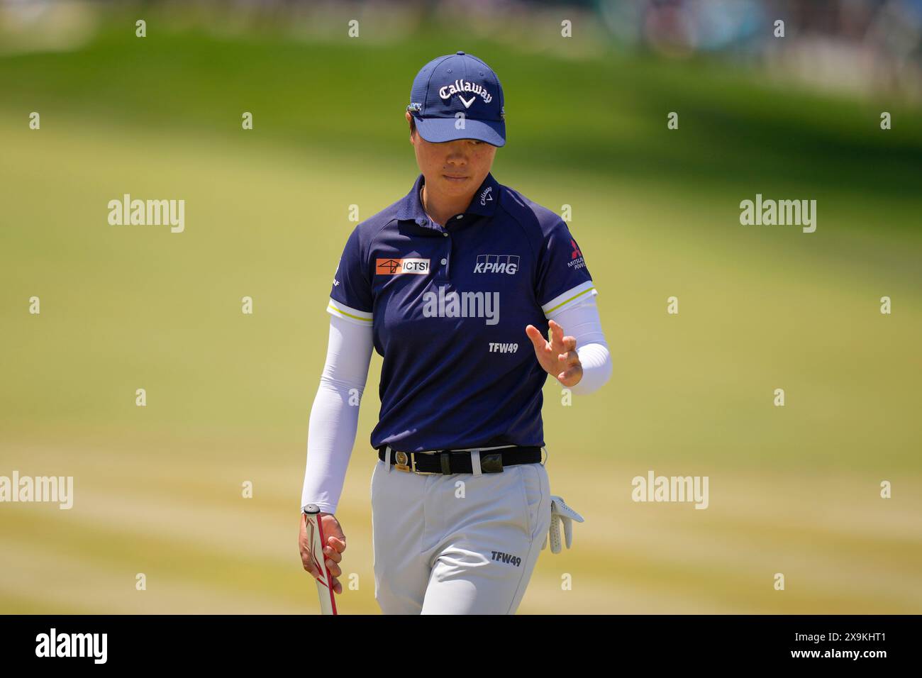 Yuka Saso, of Japan, reacts after birdying on the first green during ...