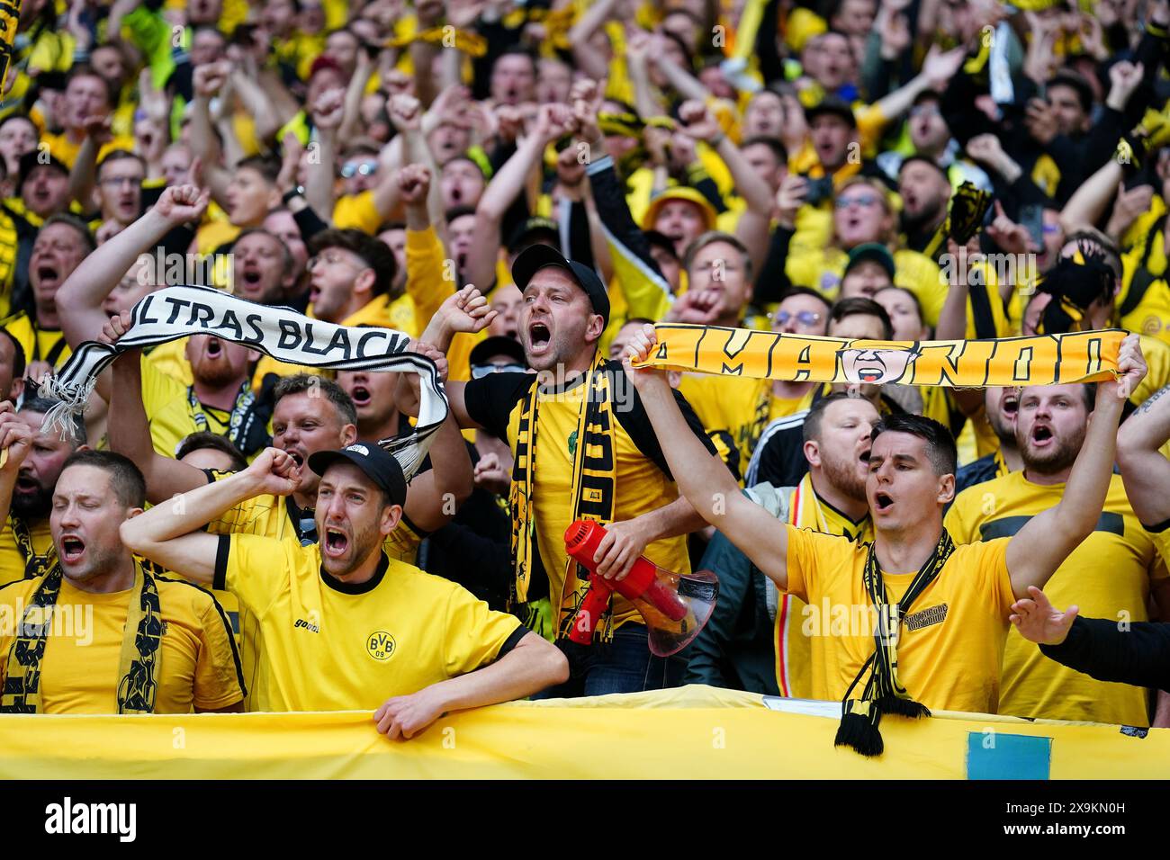 Borussia Dortmund fans show their support in the stands ahead of the ...