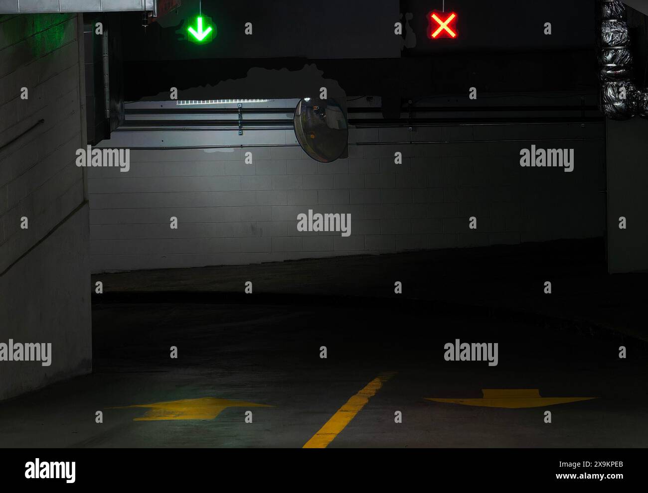 Looking deep down a ramp to an underground parking garage Stock Photo ...