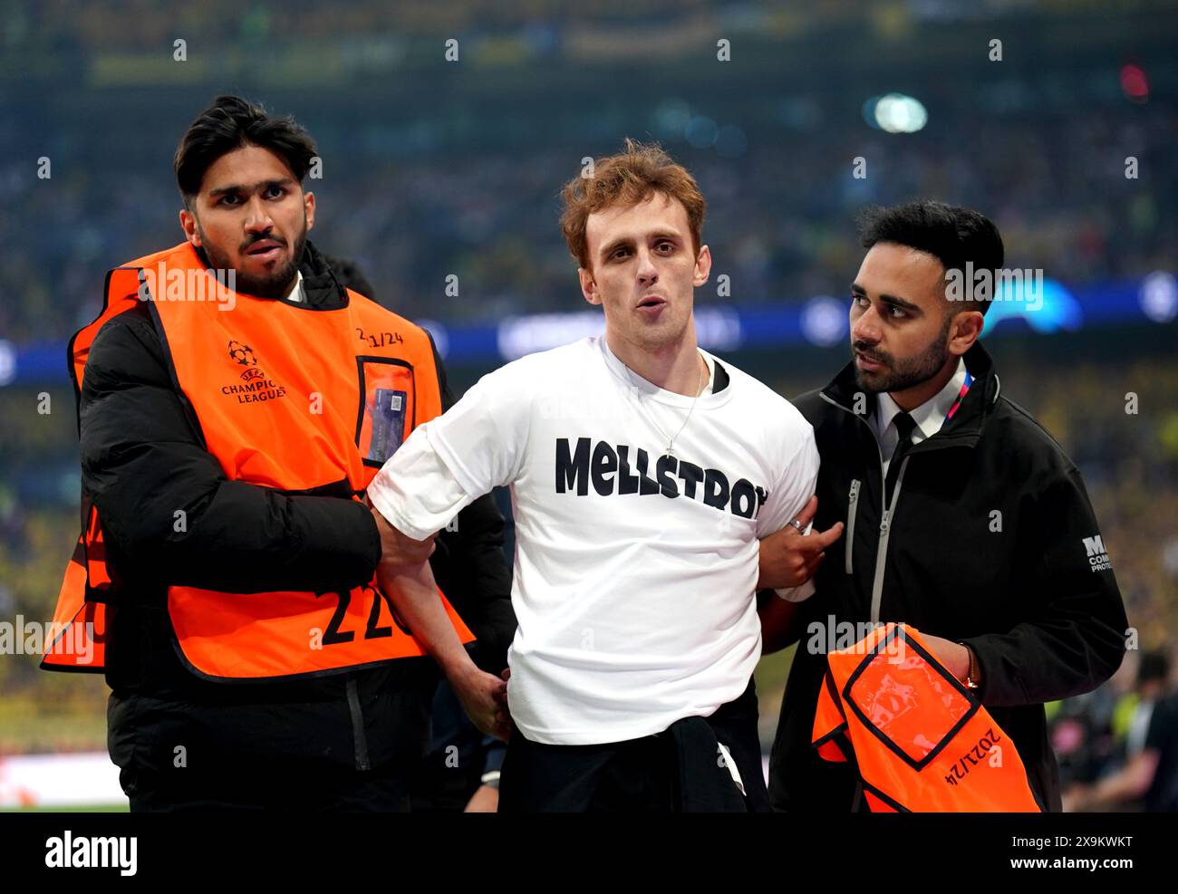 Stewards remove a pitch invader during the UEFA Champions League final ...